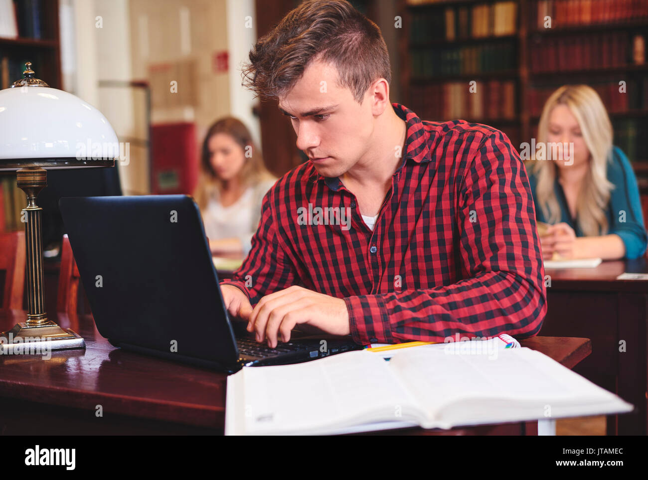 He studying with the help of technology Stock Photo - Alamy