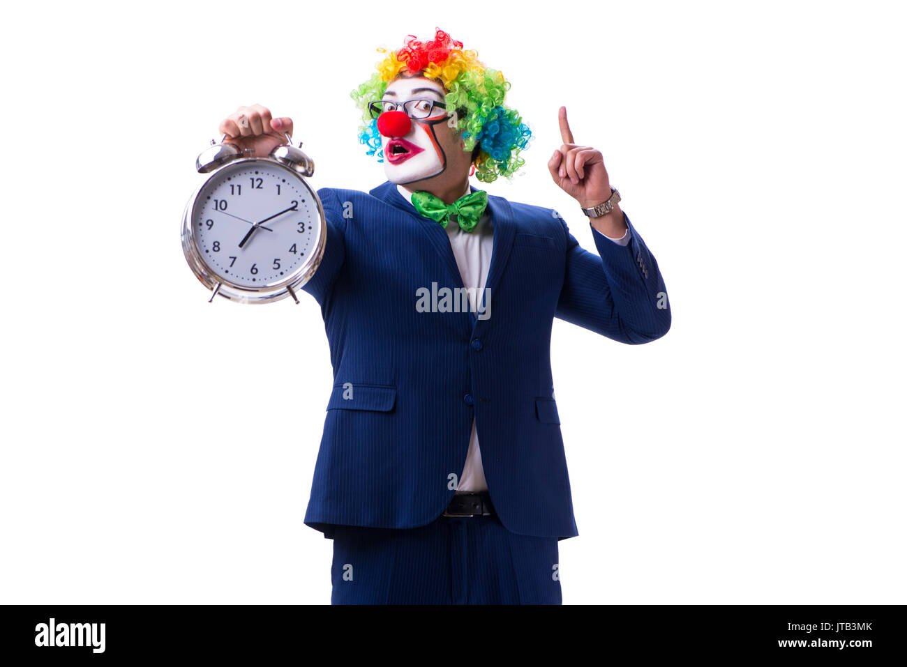 Funny clown businessman with an alarm clock isolated on white backgound ...