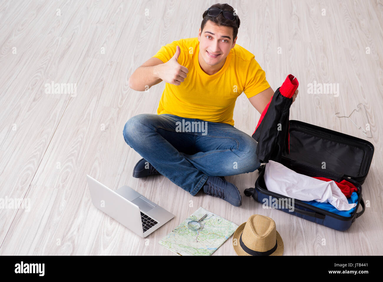Man planning his vacation trip with map Stock Photo - Alamy