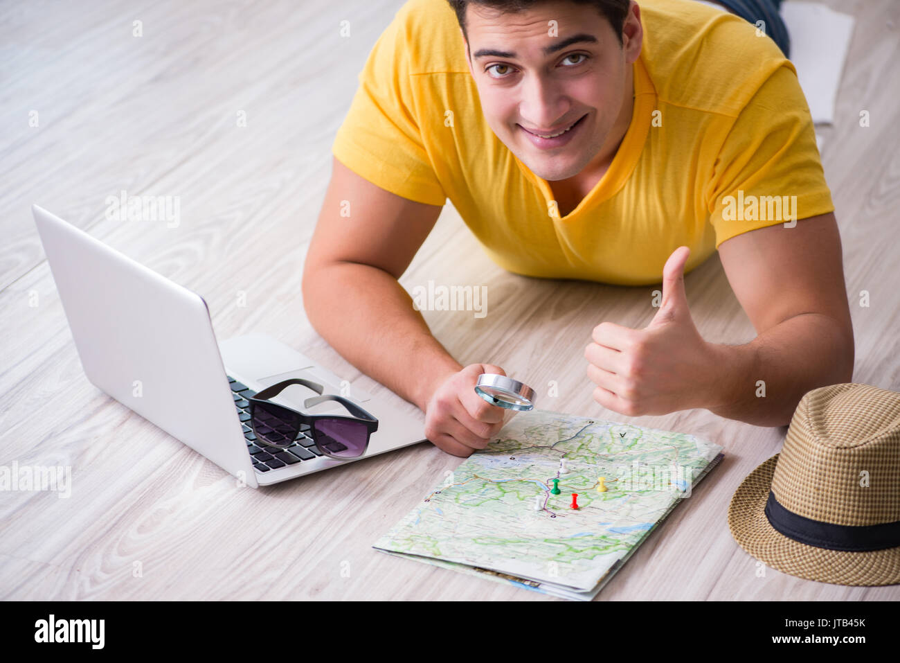 Man planning his vacation trip with map Stock Photo - Alamy
