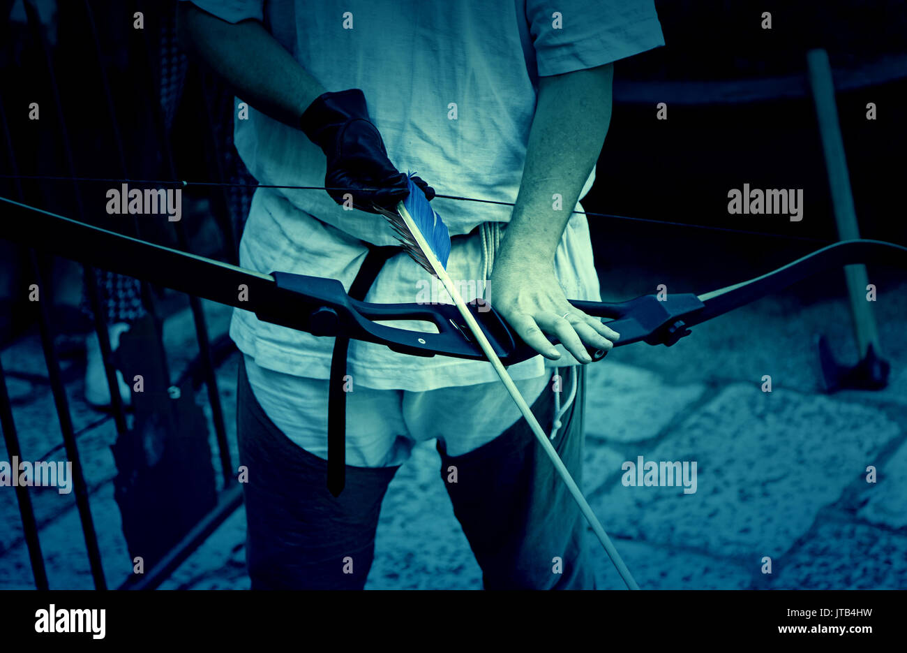 Arque preparing to shoot an arrow, detail of ancient deadly weapon ...