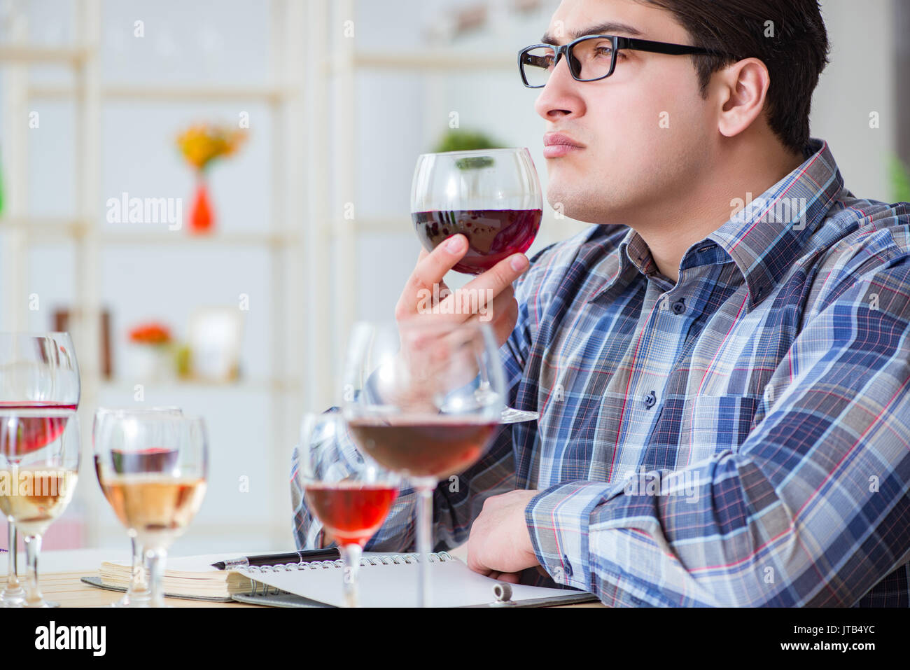 Professional sommelier tasting red wine Stock Photo - Alamy