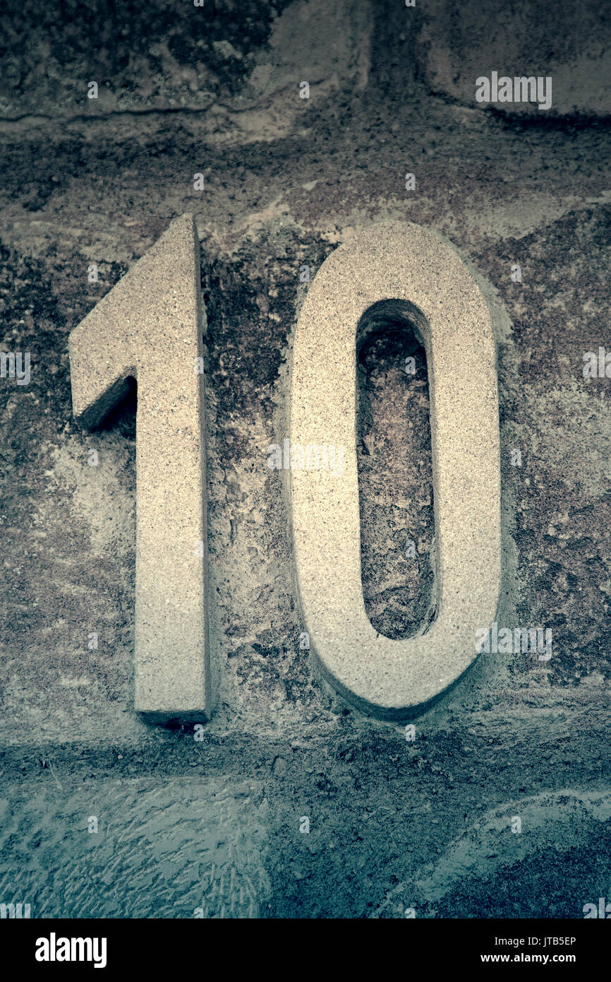 Number ten of stone, detail of a couple of information Stock Photo - Alamy