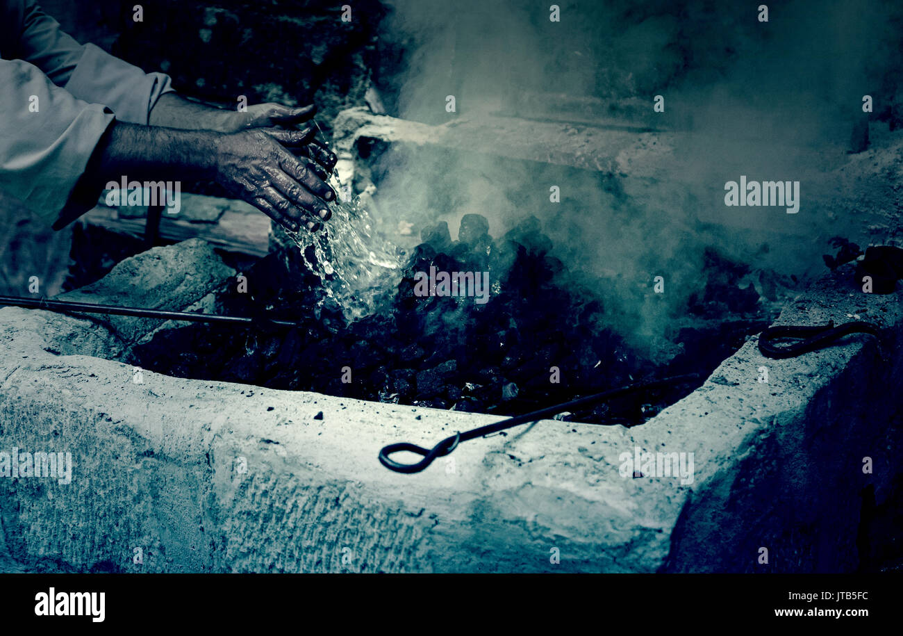 Extinguishing flames with water in the carbon, safety detail Stock ...