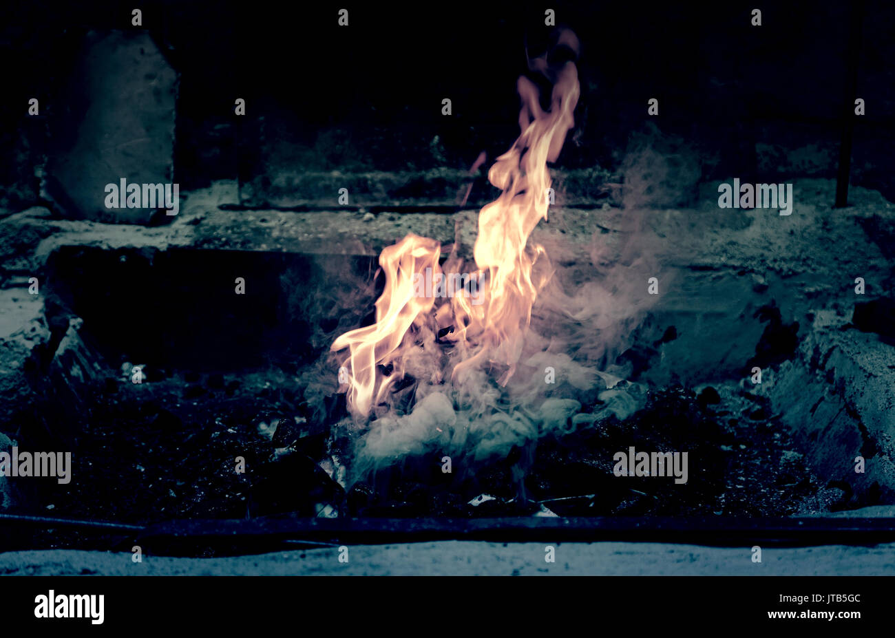 Carbon fire in a forge, detail of a workshop with iron Stock Photo - Alamy
