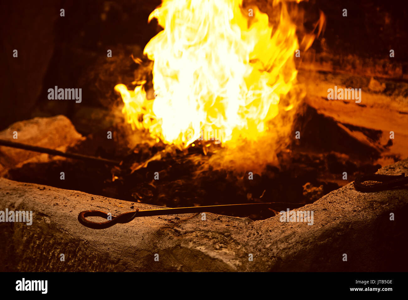 Carbon fire in a forge, detail of a workshop with iron Stock Photo - Alamy