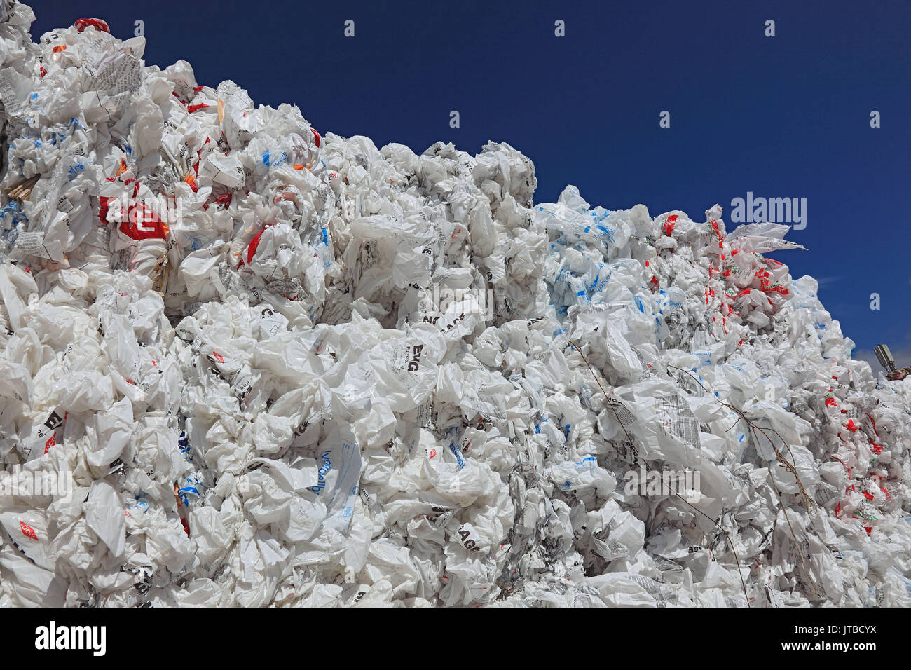 Bags with kind-pure plastic rubbish, foils, in a recycling company ...