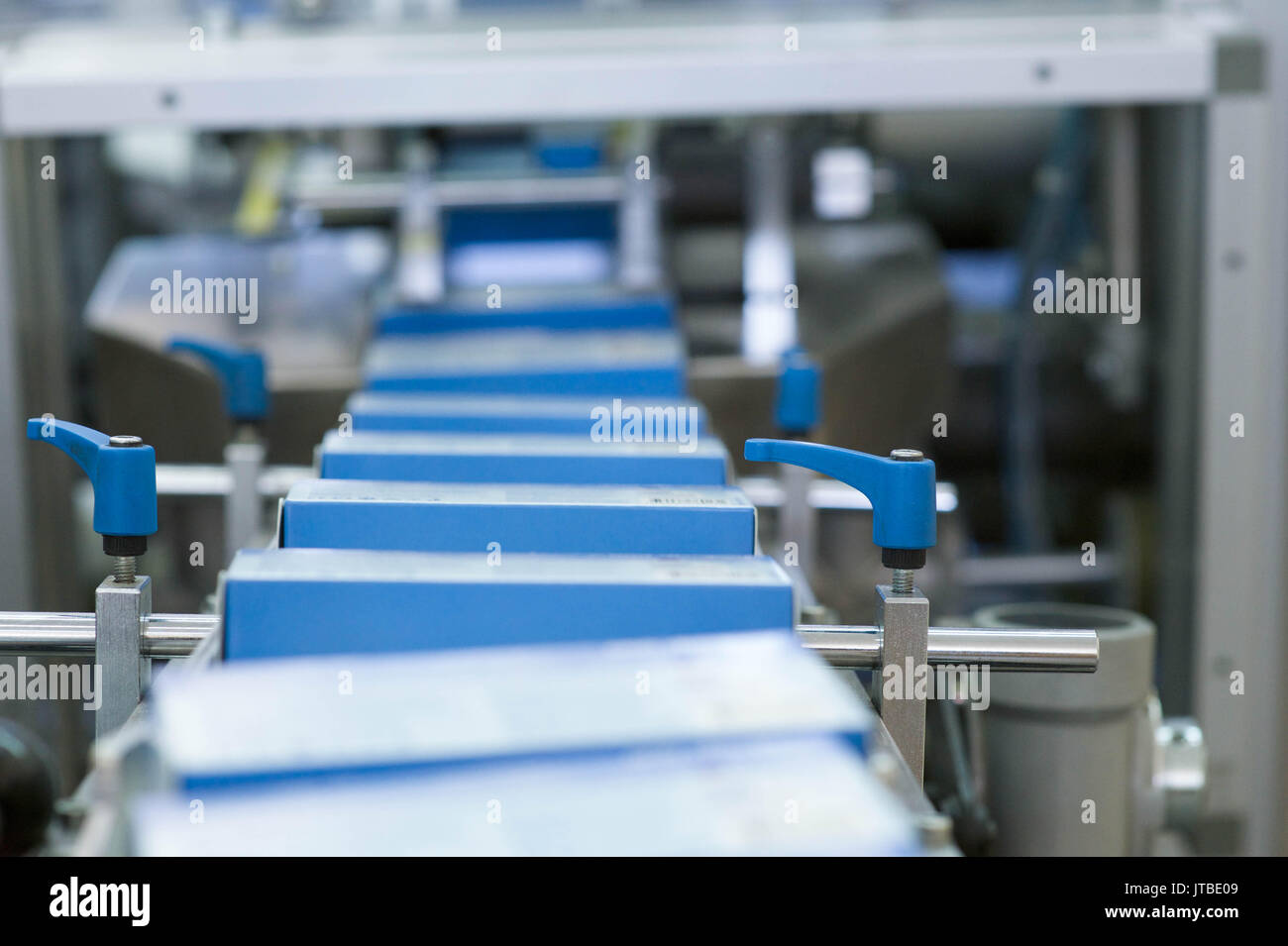Production tape in a small factory Stock Photo - Alamy