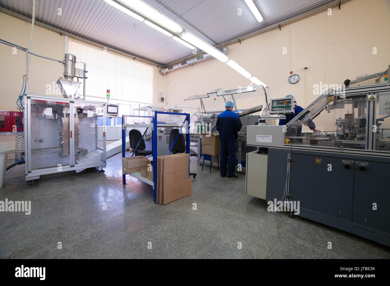 Production tape in a small factory Stock Photo - Alamy