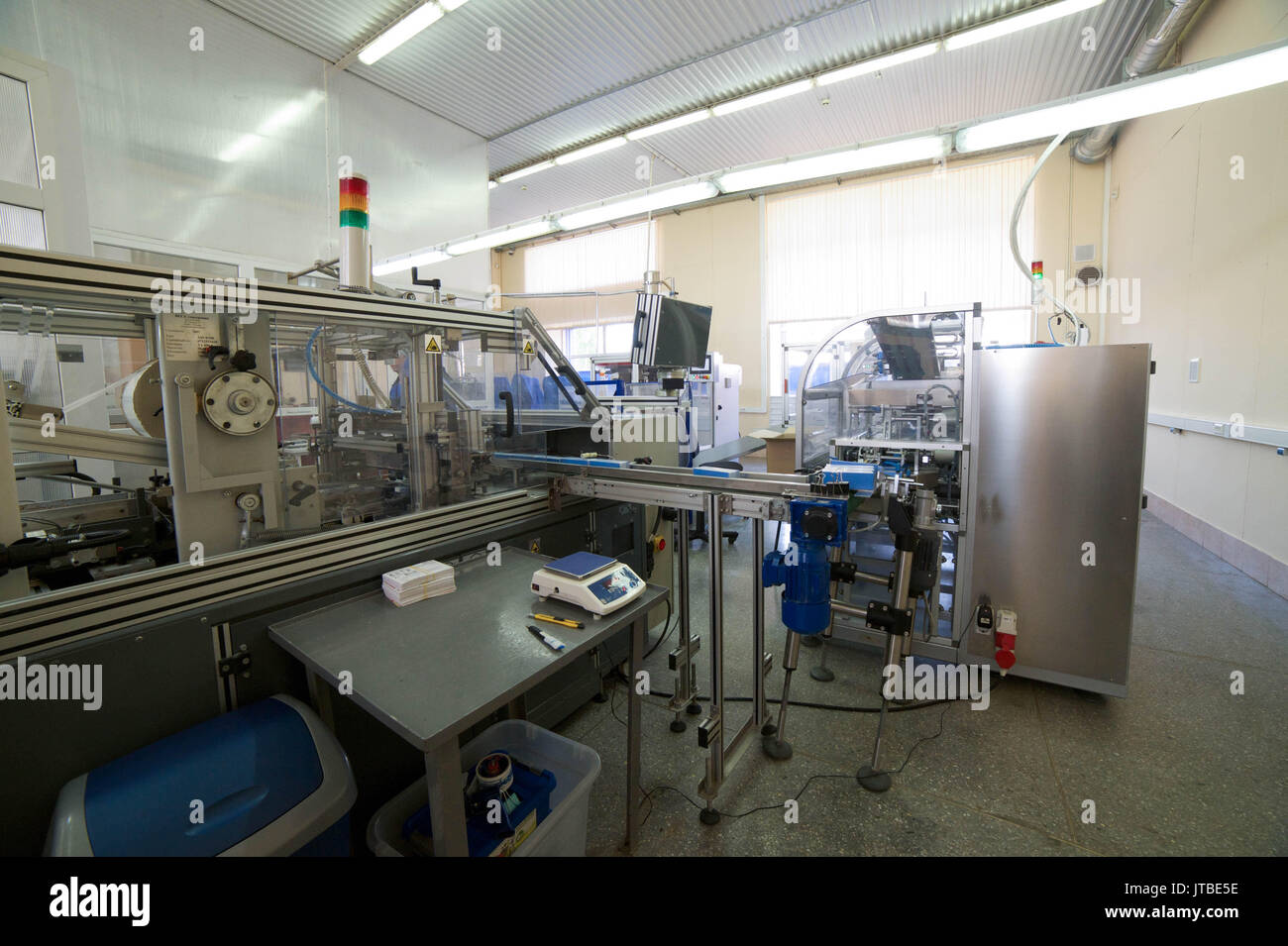 Production tape in a small factory Stock Photo - Alamy