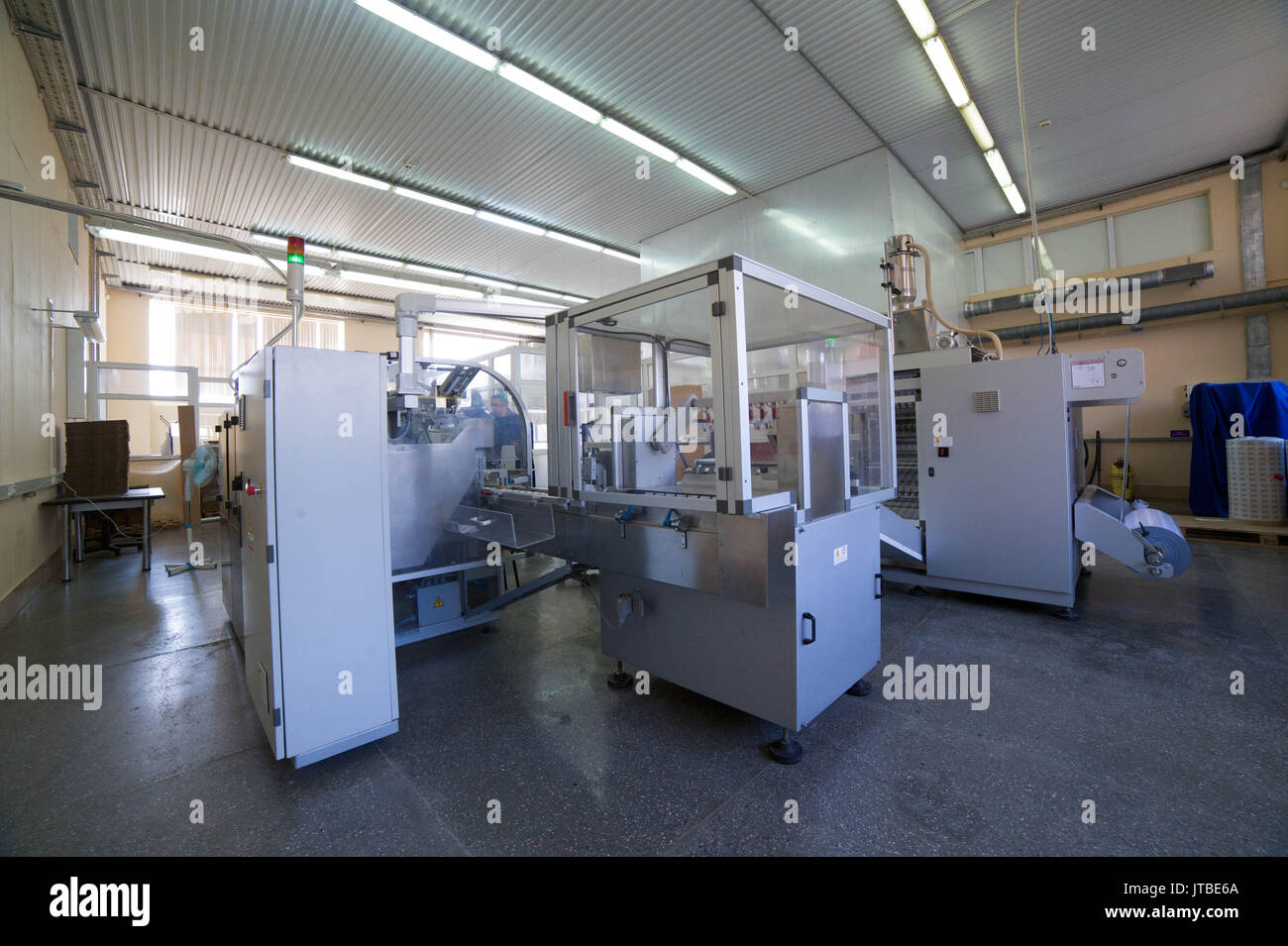 Production tape in a small factory Stock Photo - Alamy