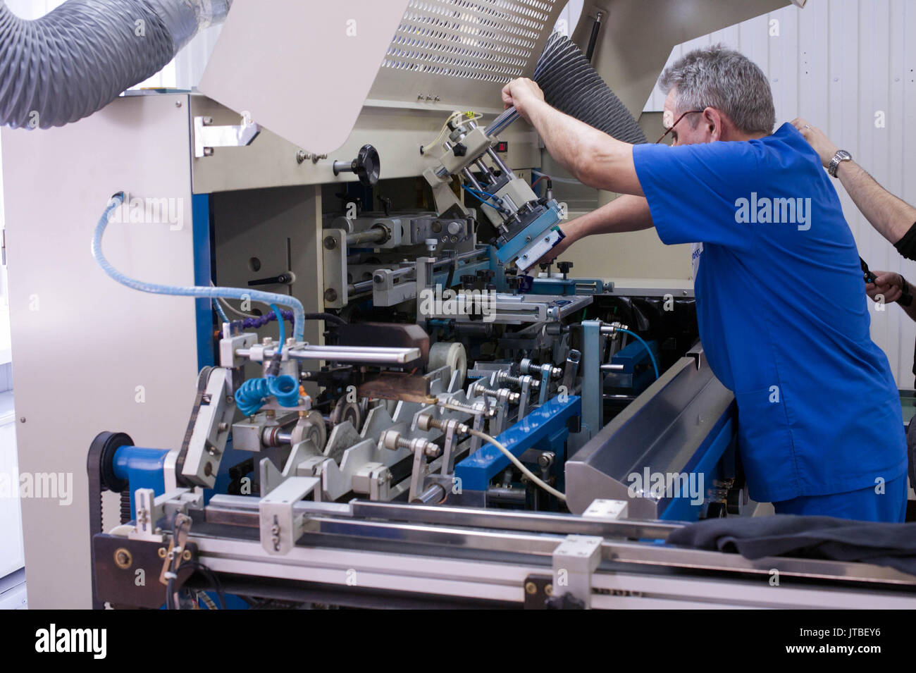 Repair of the tape in the factory Stock Photo - Alamy