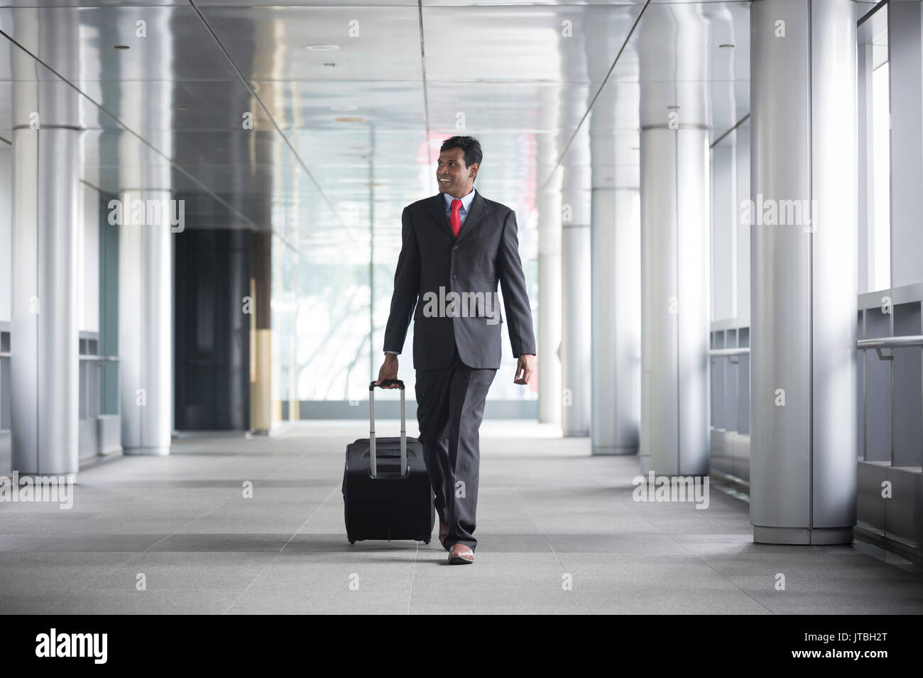 Indian businessman walking hi-res stock photography and images - Alamy