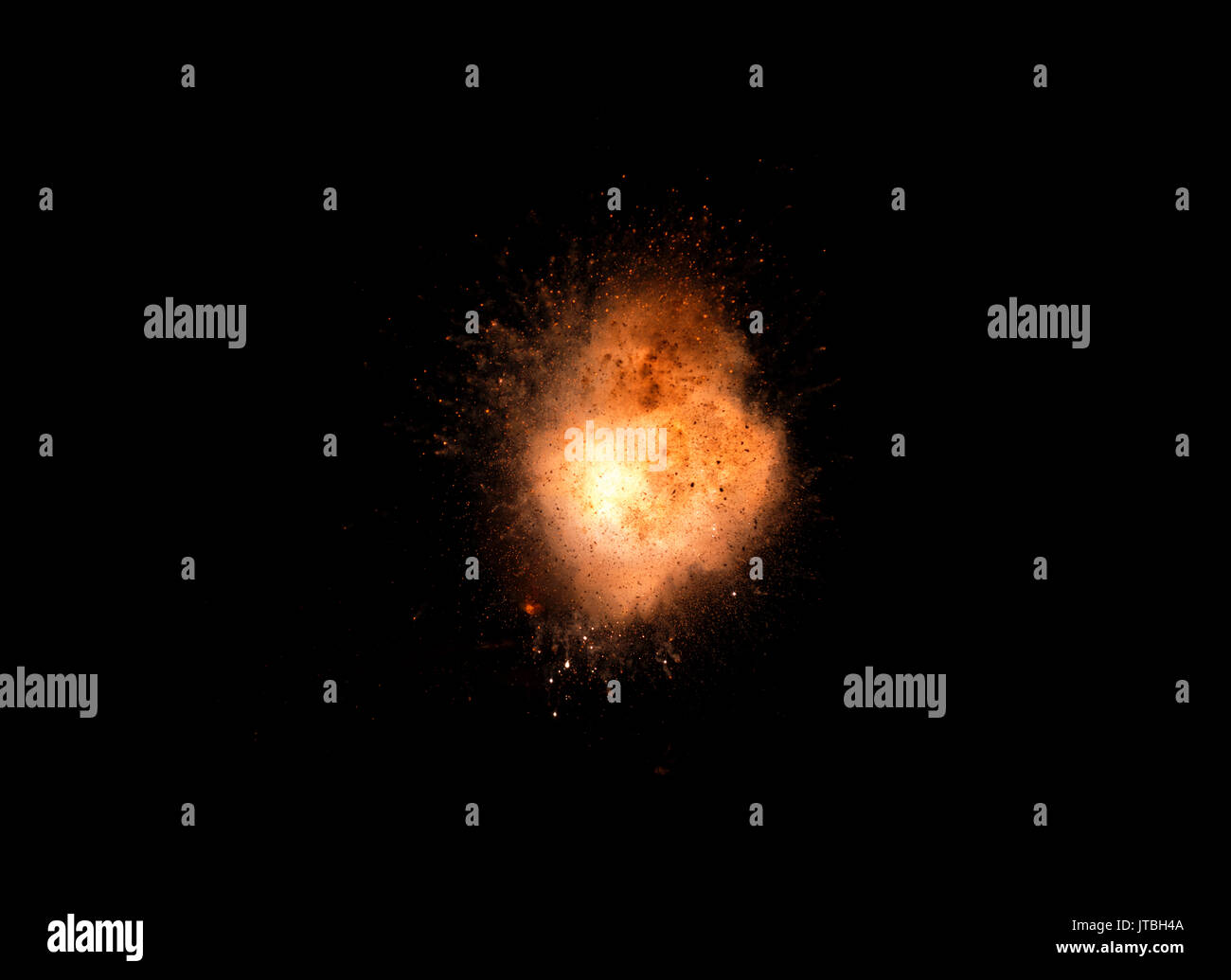 Huge, extremely hot explosion with sparks and hot smoke, against black ...