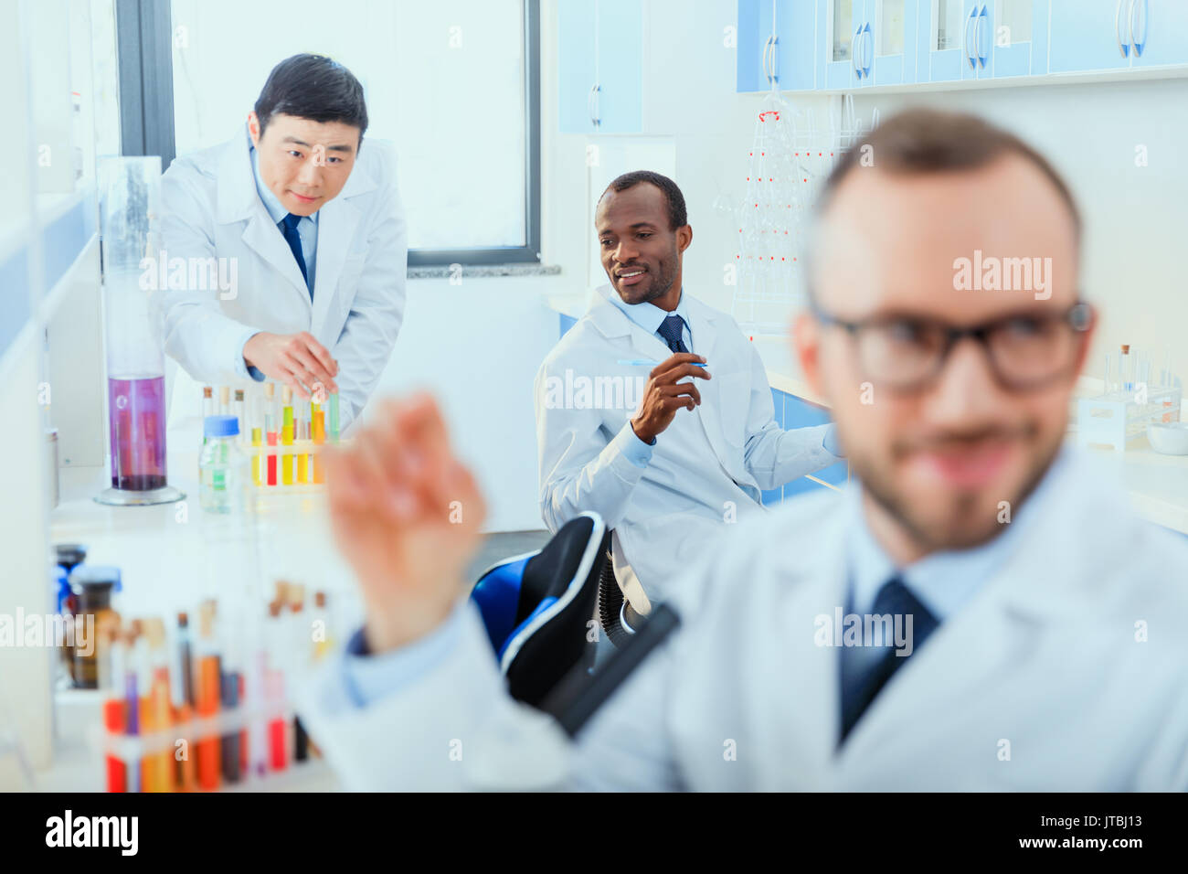 Men in laboratory with test tubes hi-res stock photography and images ...