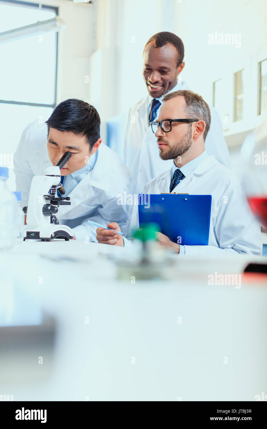 young doctors in uniform working at testing laboratory, laboratory ...