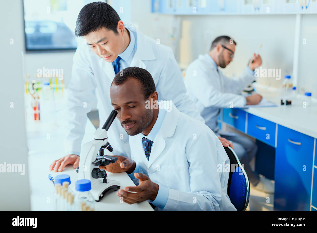 Men in laboratory with test tubes hi-res stock photography and images ...