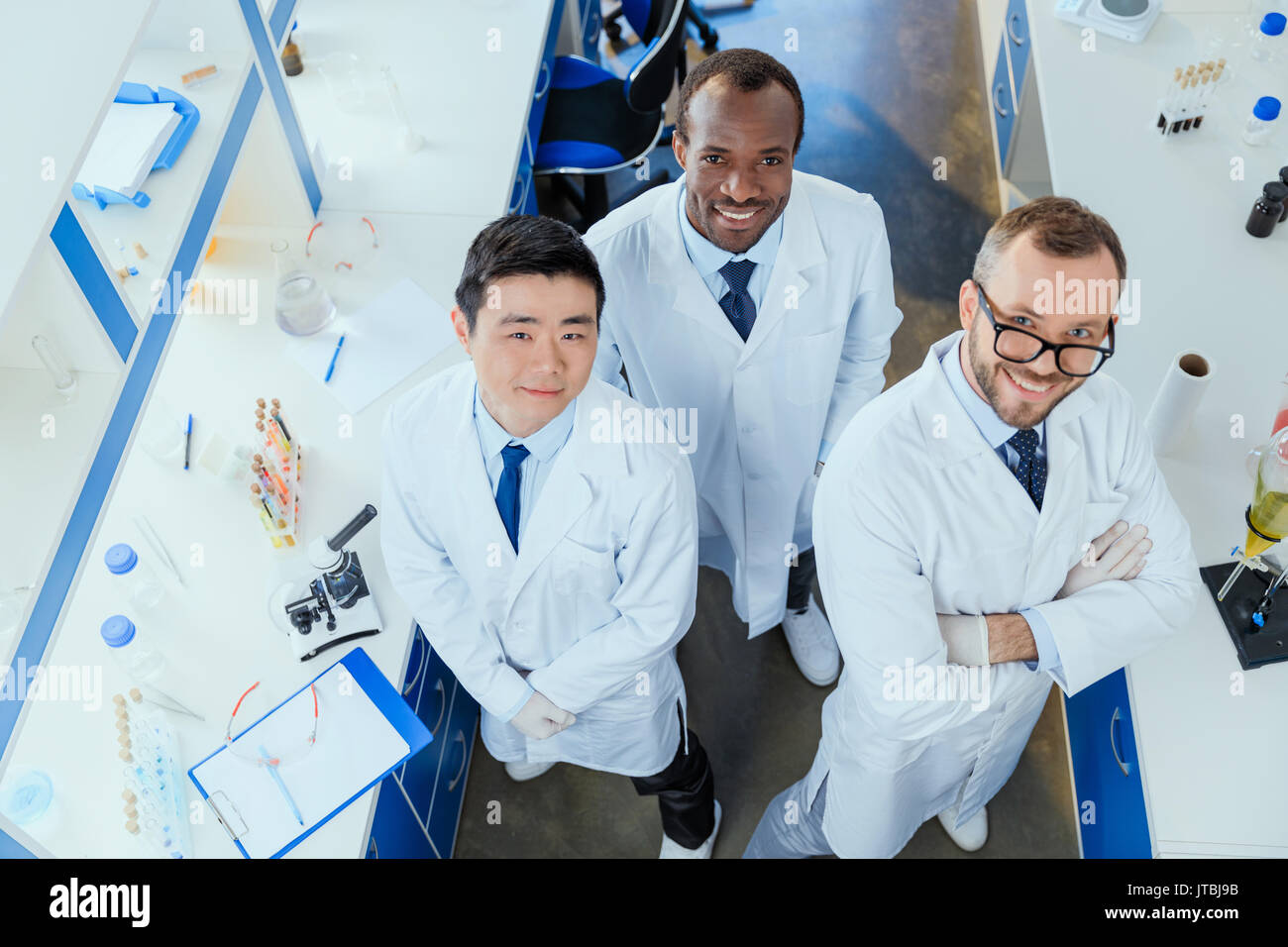 High angle view of multiracial group of scientists standing together in ...
