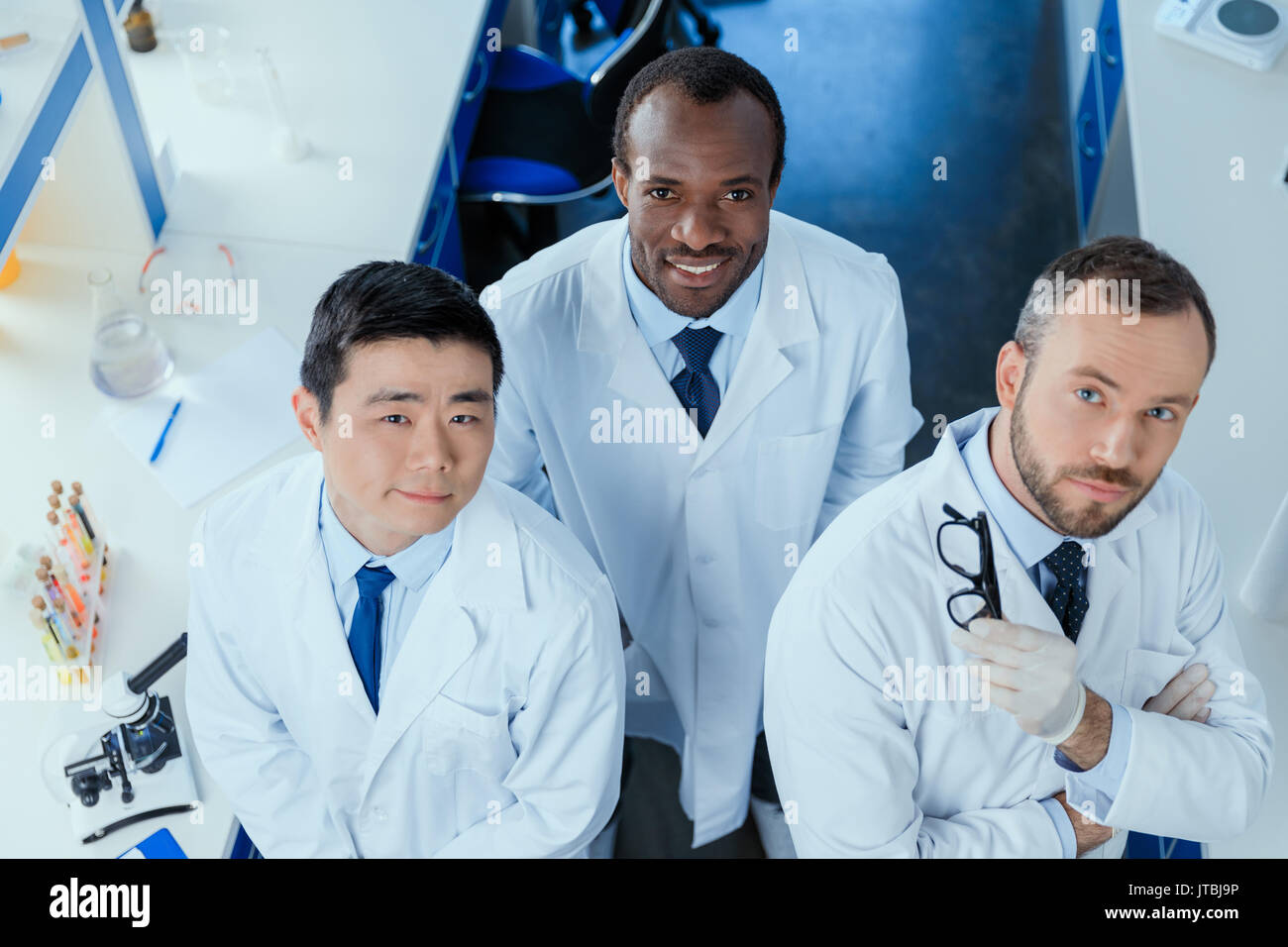 High angle view of multiracial group of scientists standing together in ...