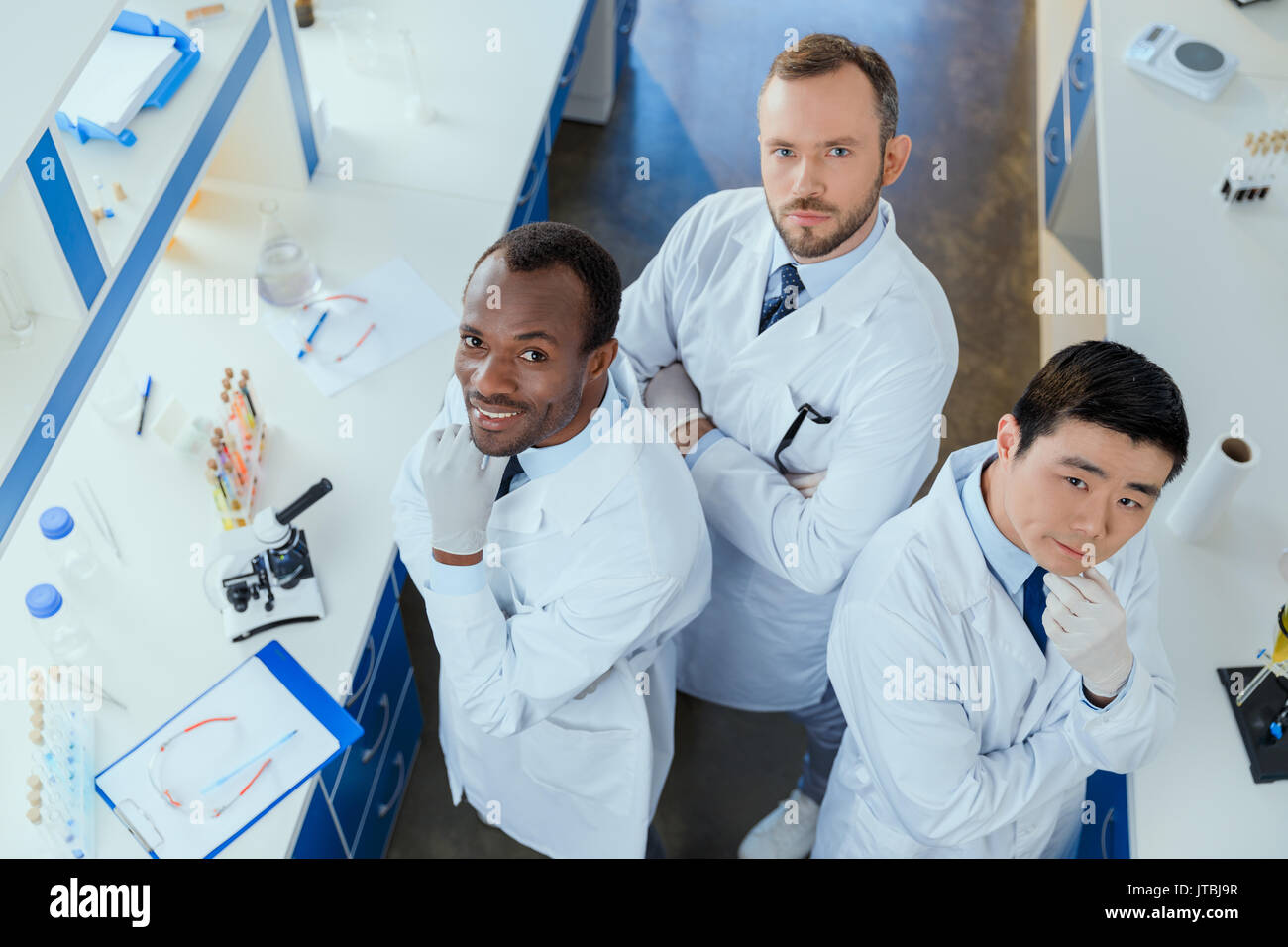 High angle view of multiracial group of scientists standing together in ...