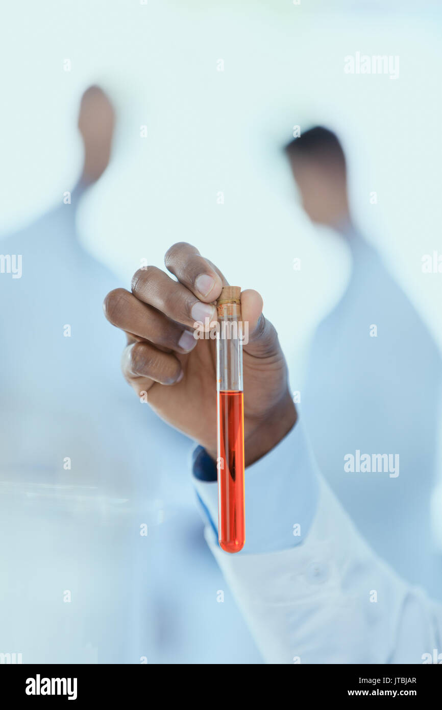 Scientist holding test tube hi-res stock photography and images - Alamy