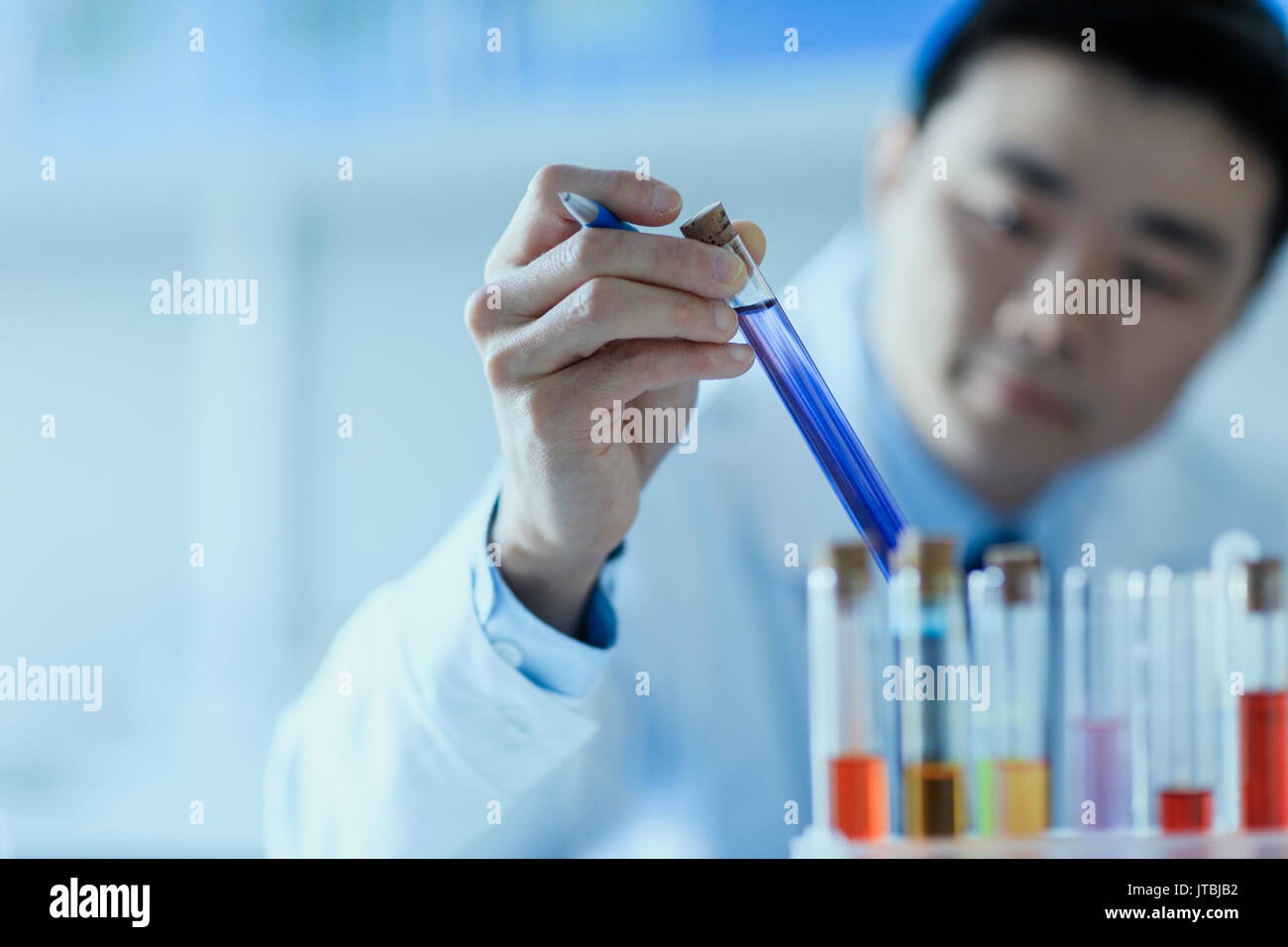 Asian scientist hold test hi-res stock photography and images - Alamy