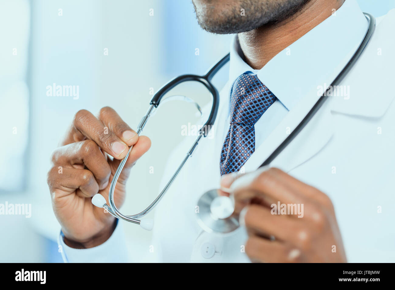 partial side view of doctor holding stethoscope in hands Stock Photo ...