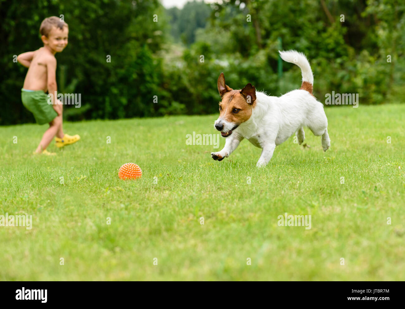 Child catching ball hi-res stock photography and images - Alamy