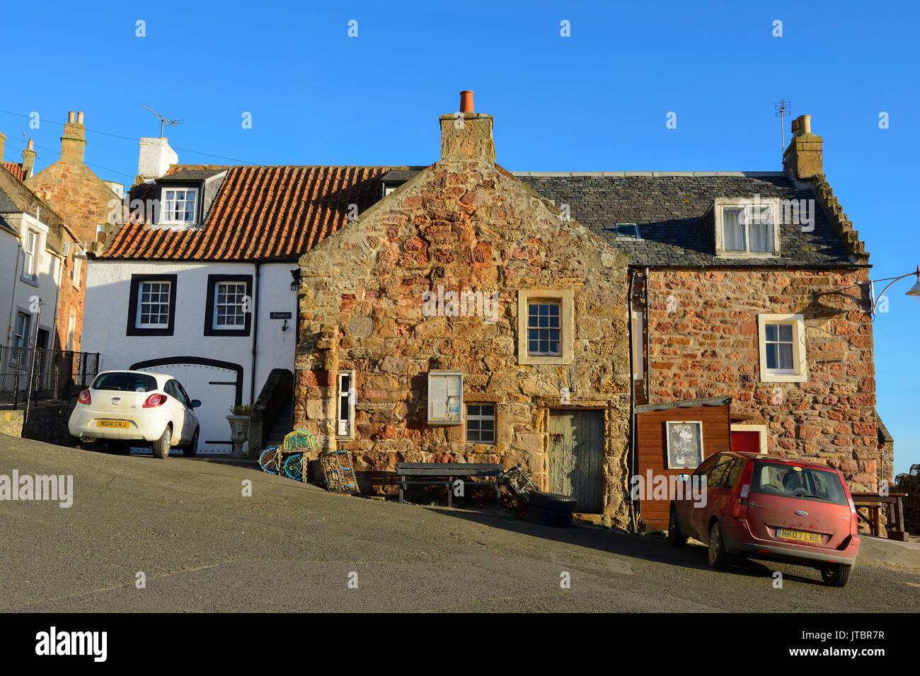 Renovated buildings in waterfront of Scottish coastal town of Crail in ...