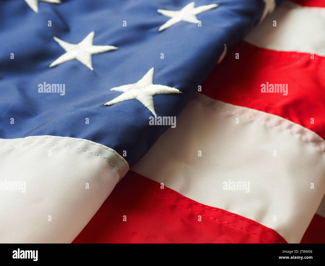 Detail of a partial folded American flag using as background Stock ...