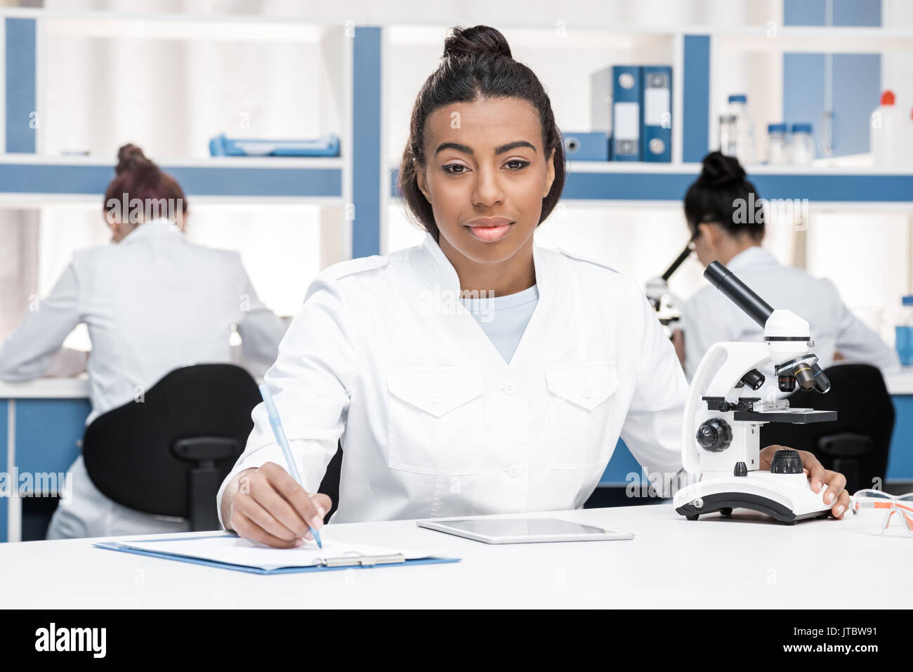 Scientists in research lab behind hi-res stock photography and images ...
