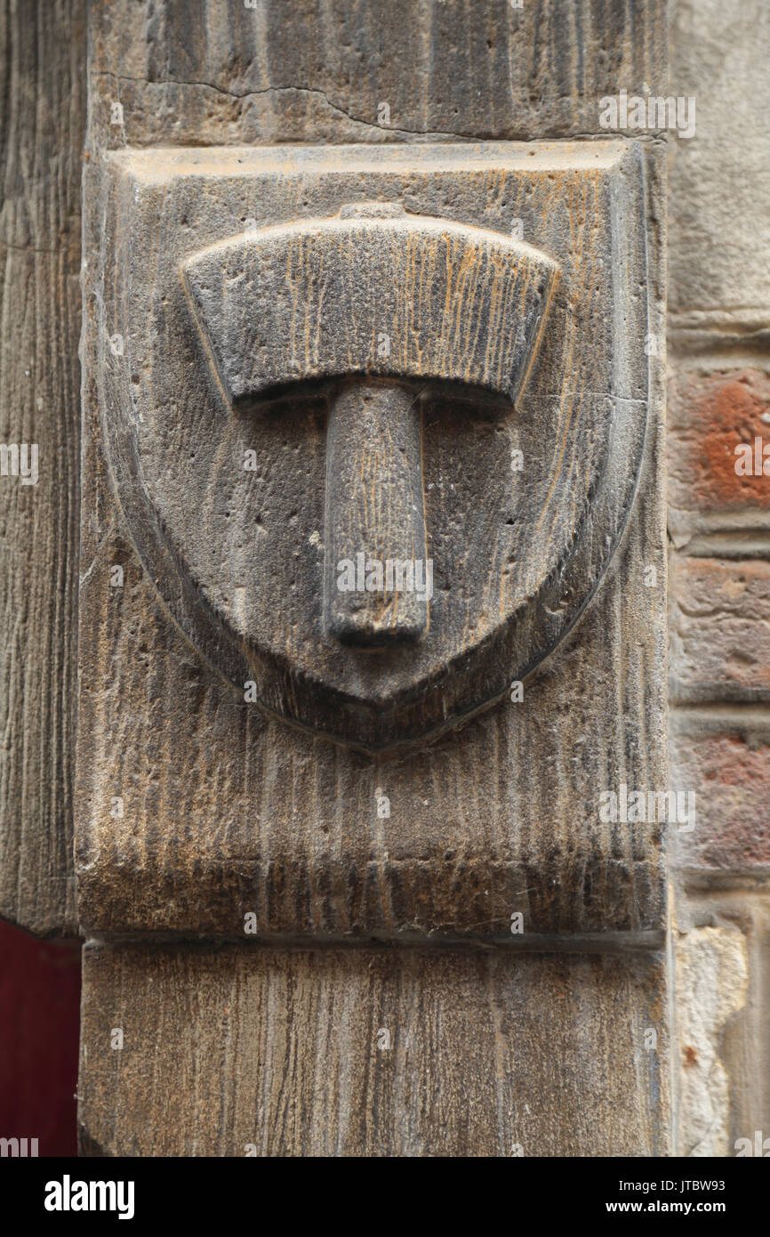 Carving of mallet in stone on wall of building in Rue Emile Zola ...