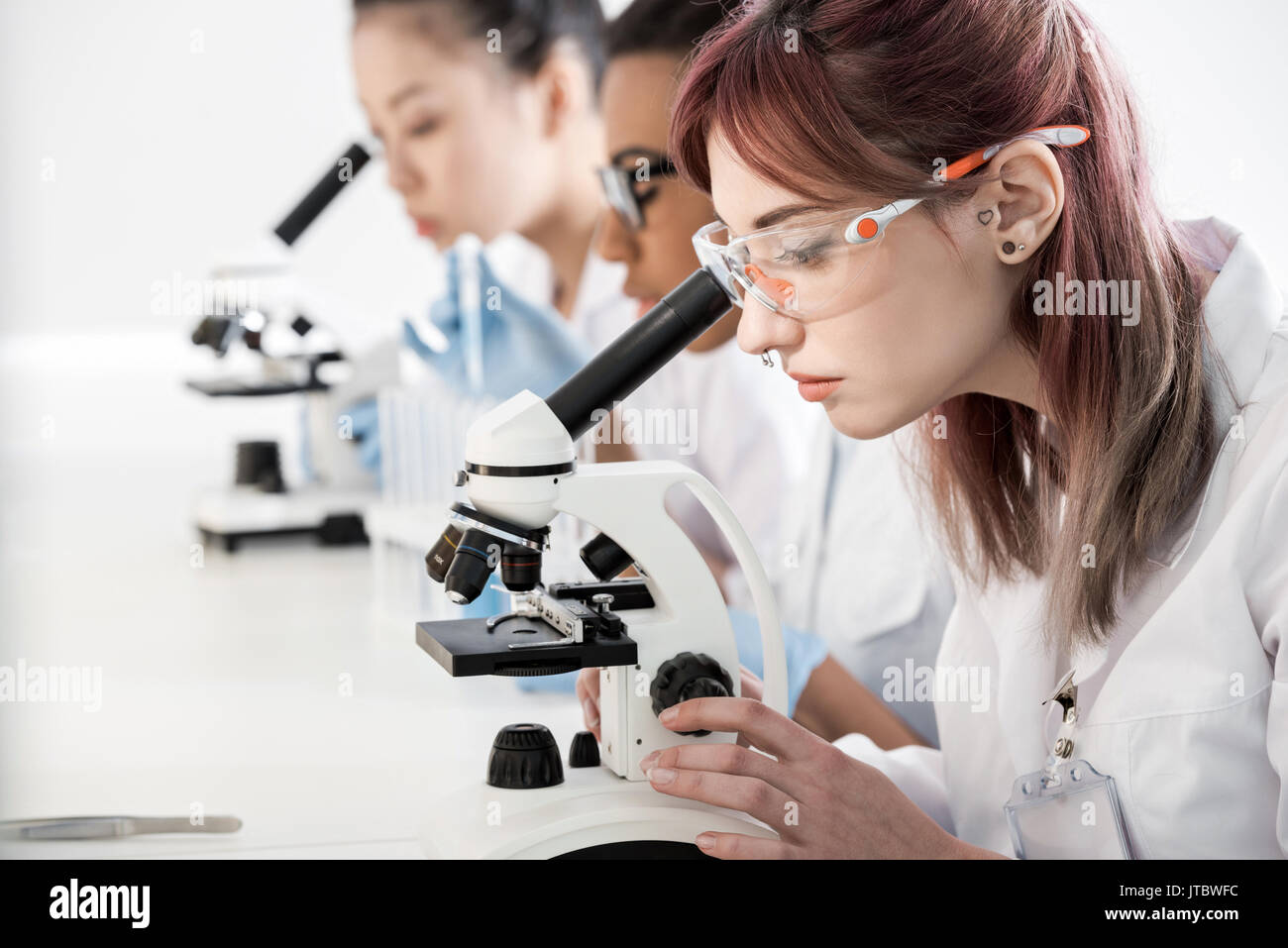 Multiethnic group of young professional scientists working with ...