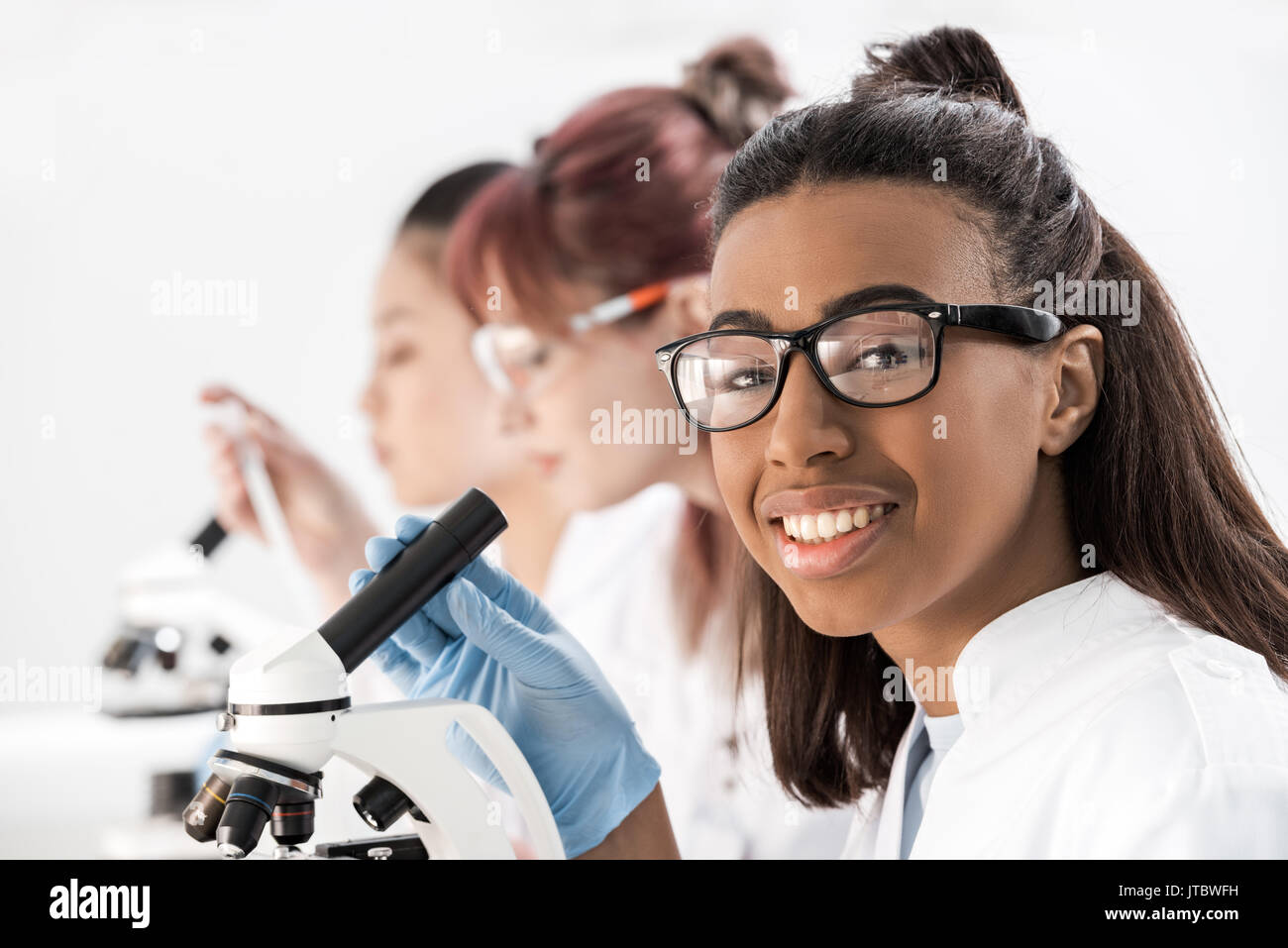 Multiethnic group of young professional scientists working with ...