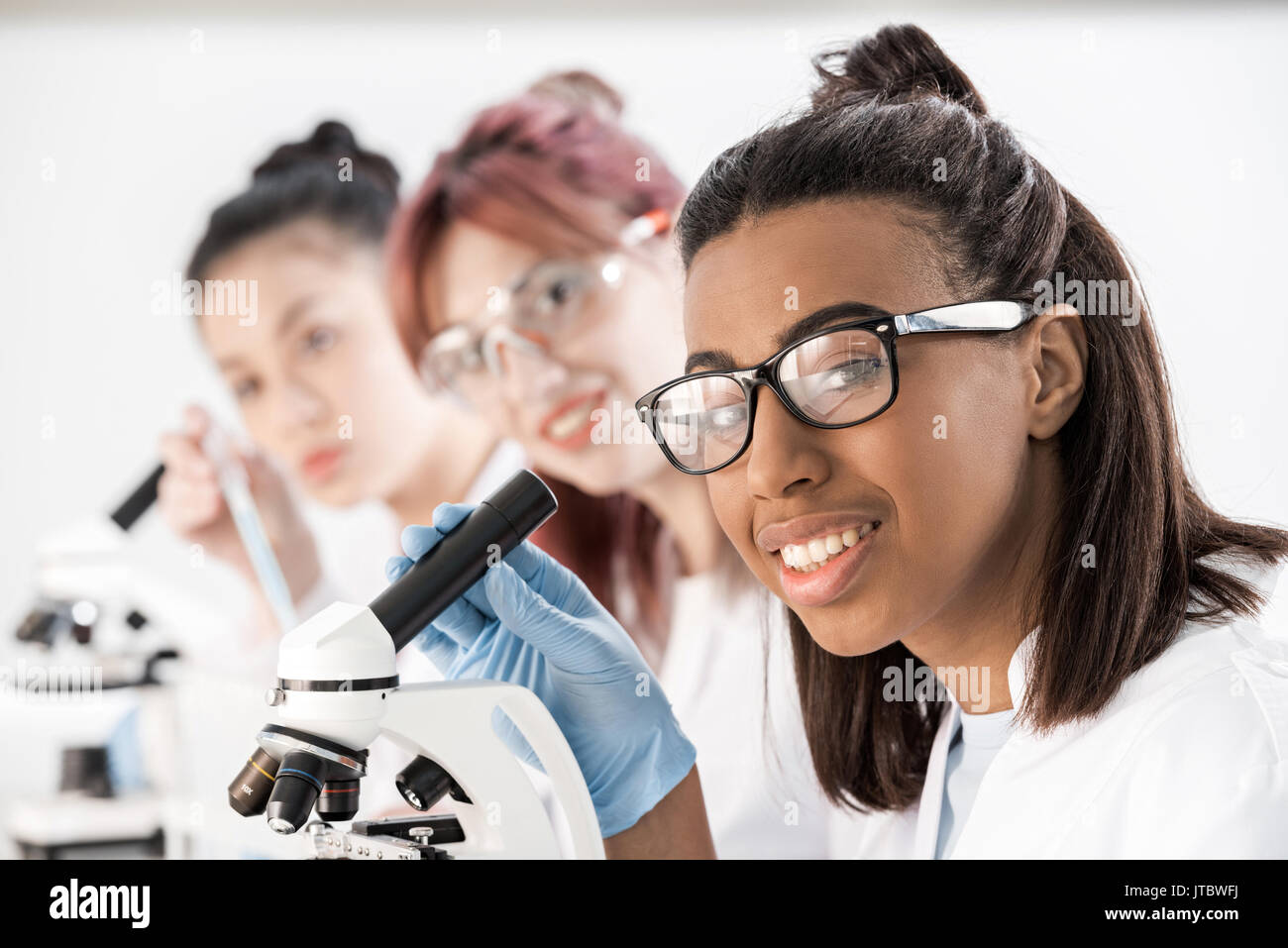 Multiethnic group of young professional scientists working with ...