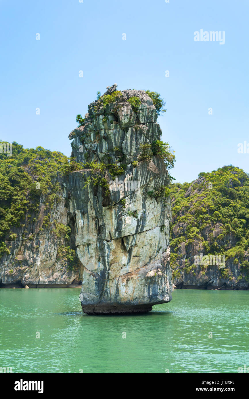 Limestone rocks and calm sea of Halong bay in Vietnam Stock Photo - Alamy