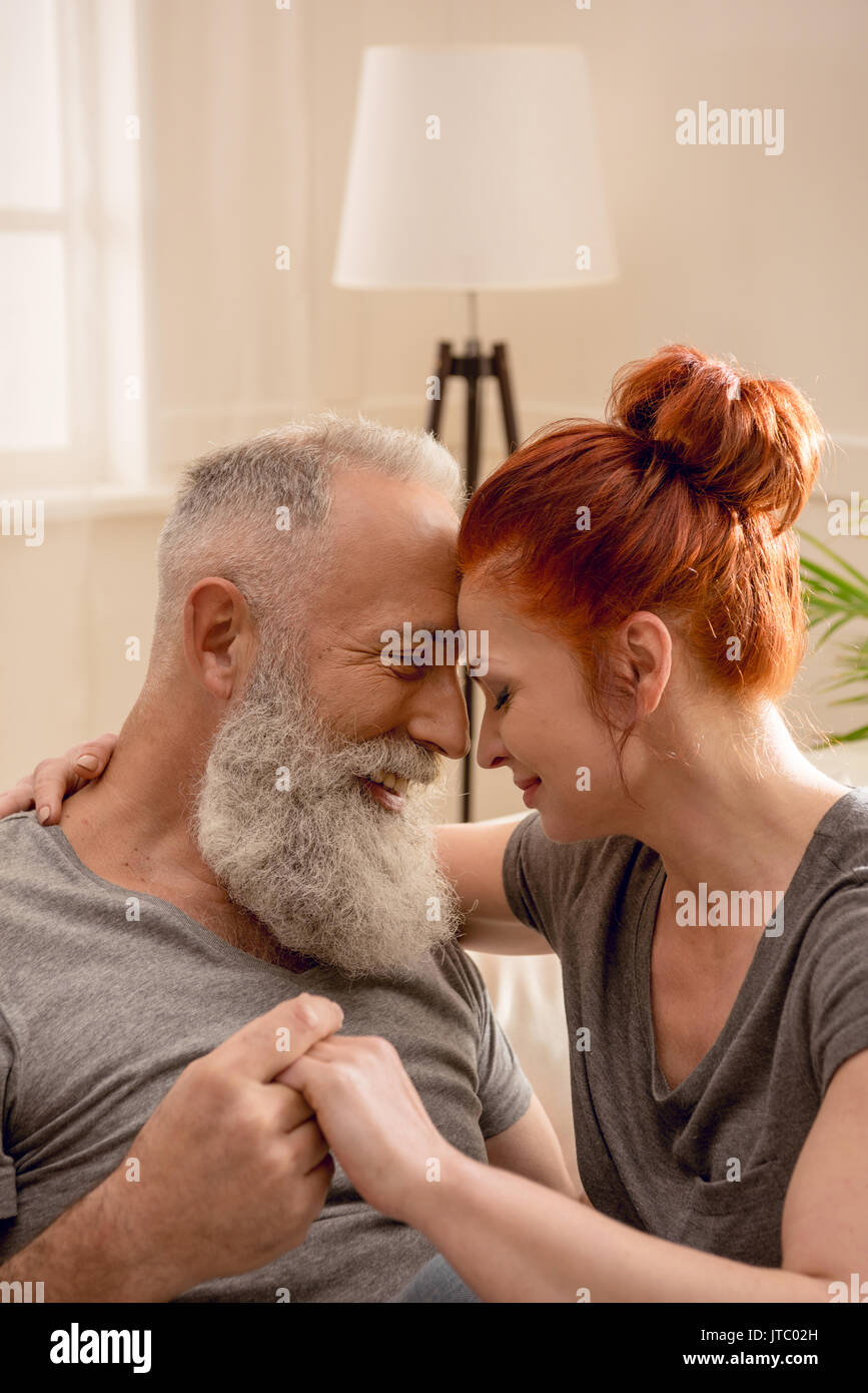 affectionate husband and wife spending time together at home Stock ...