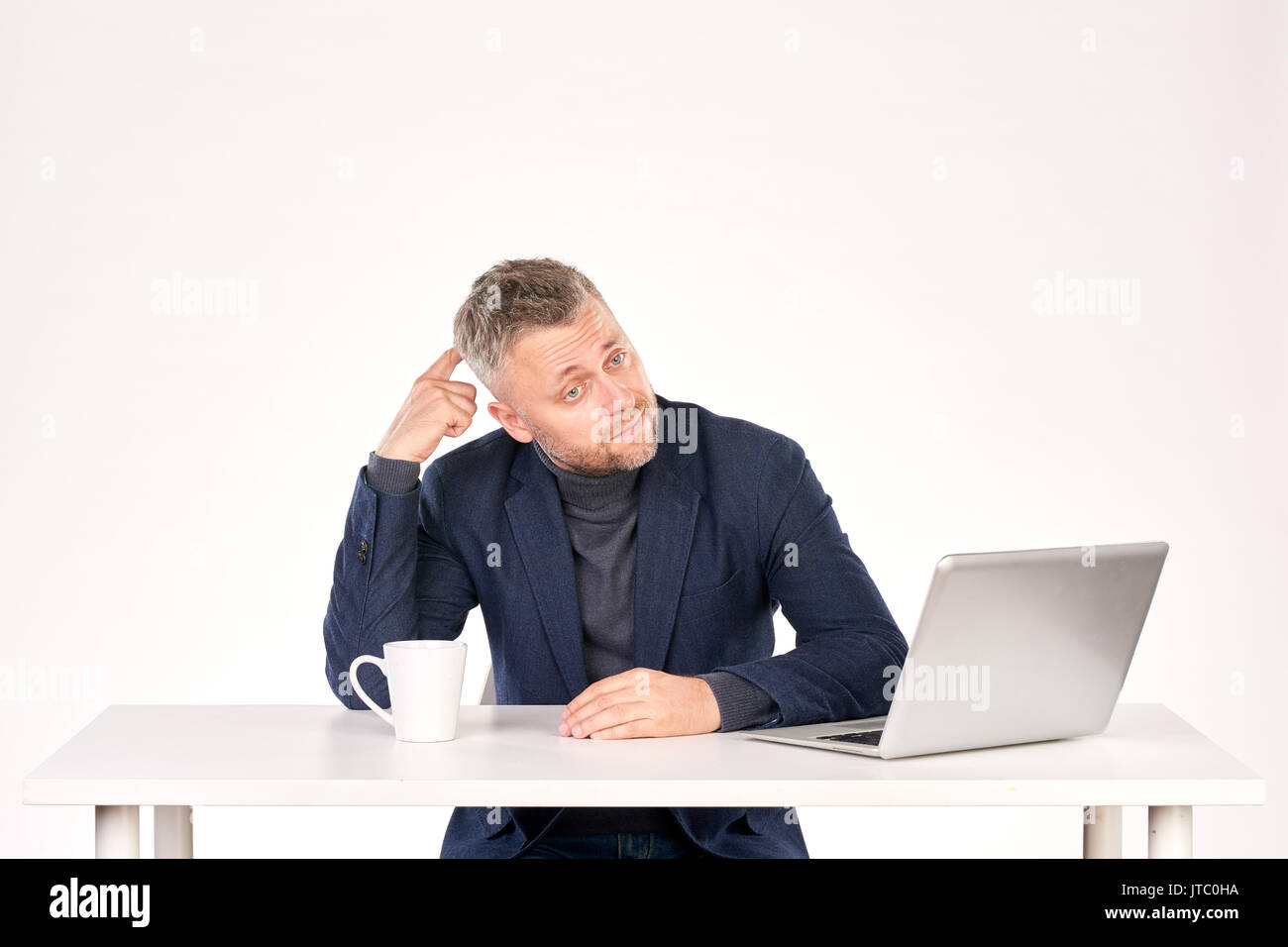 Office worker scratching head hi-res stock photography and images - Alamy