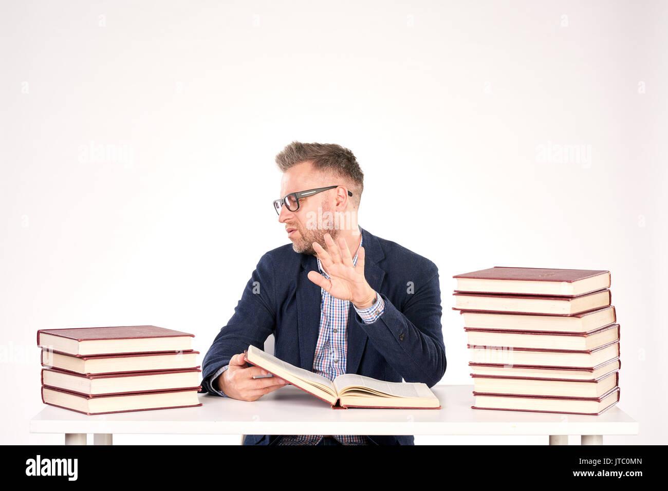 Pensive professor desk hi-res stock photography and images - Alamy