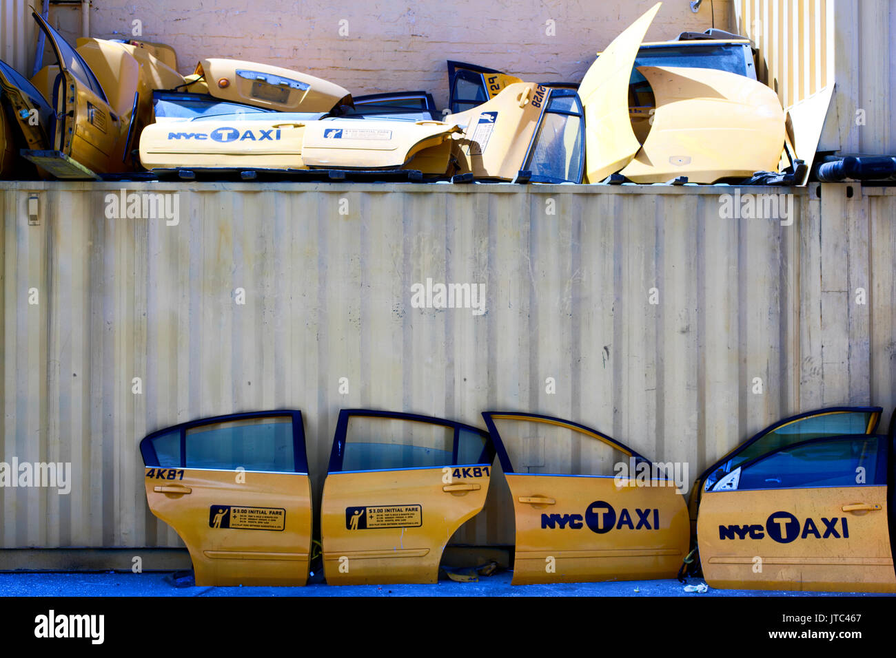 Yellow cab doors in a junk yard in NYC Stock Photo - Alamy