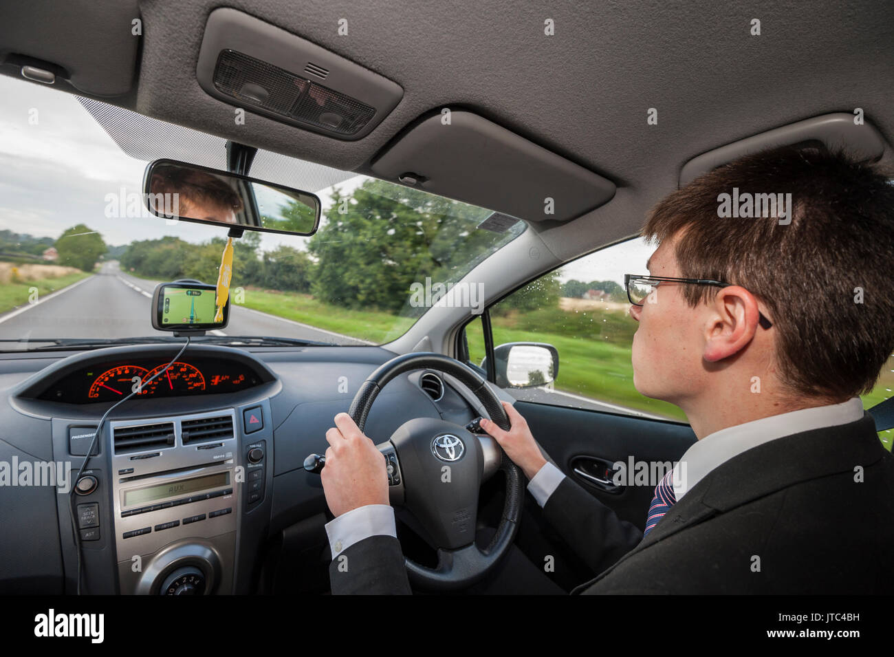 A model released teenage boy ,17 , driving on a main road in the Uk ...