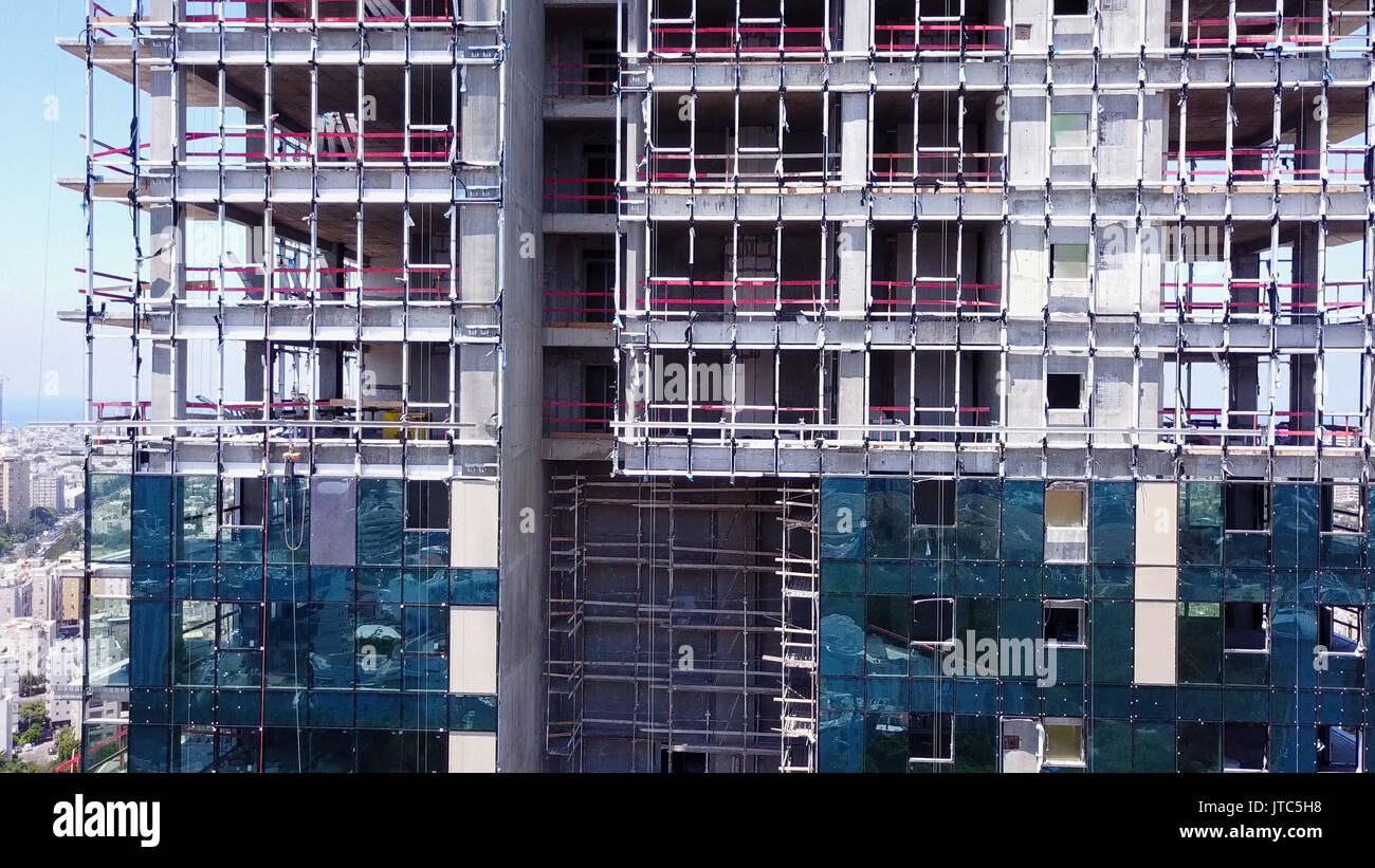 New Skyscraper building in final construction stage Stock Photo - Alamy