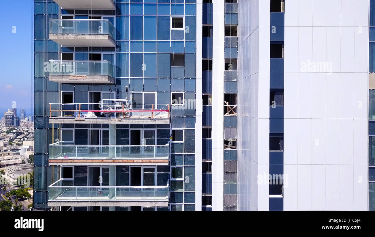 New Skyscraper building in final construction stage Stock Photo - Alamy