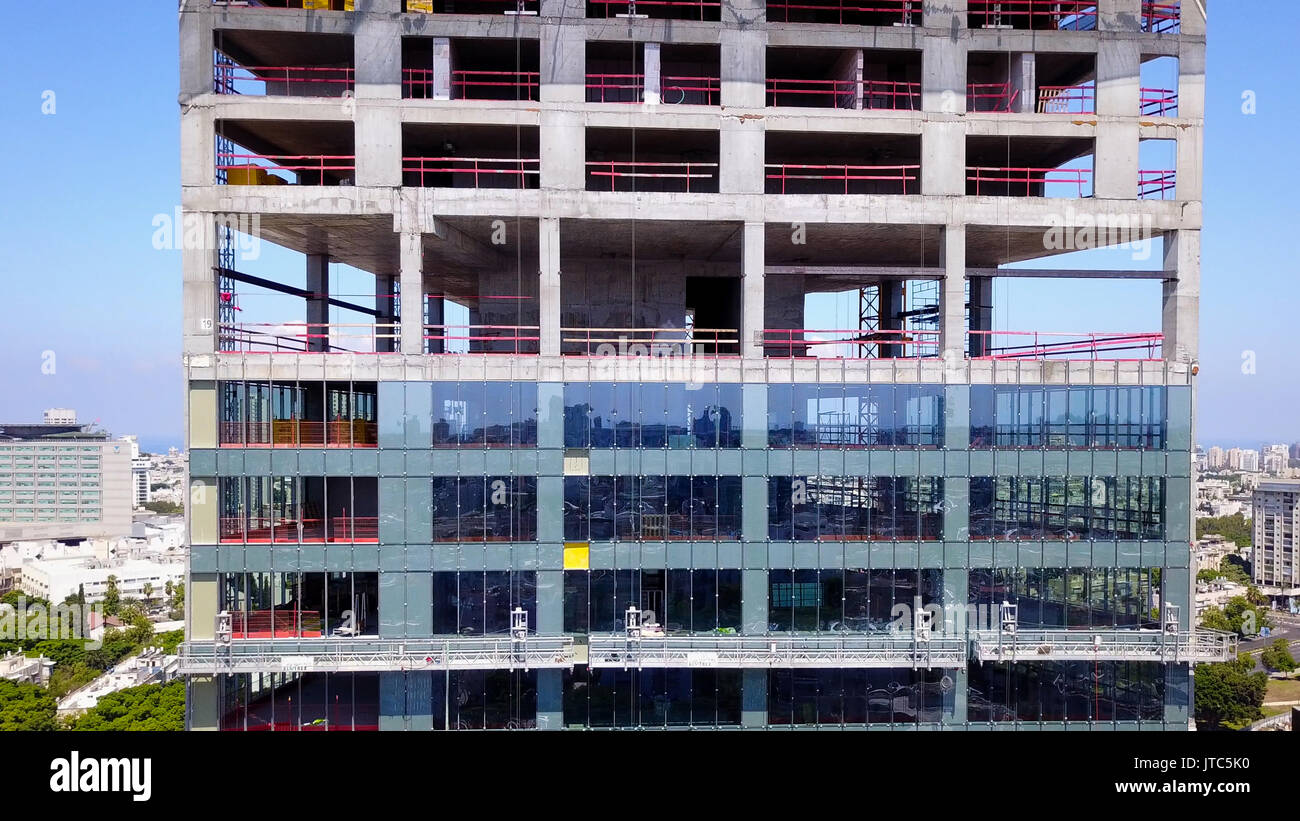 New Skyscraper building in final construction stage Stock Photo - Alamy