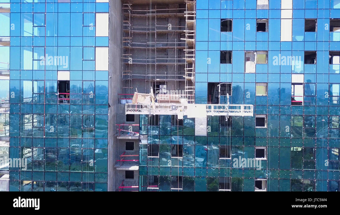New Skyscraper building in final construction stage Stock Photo - Alamy