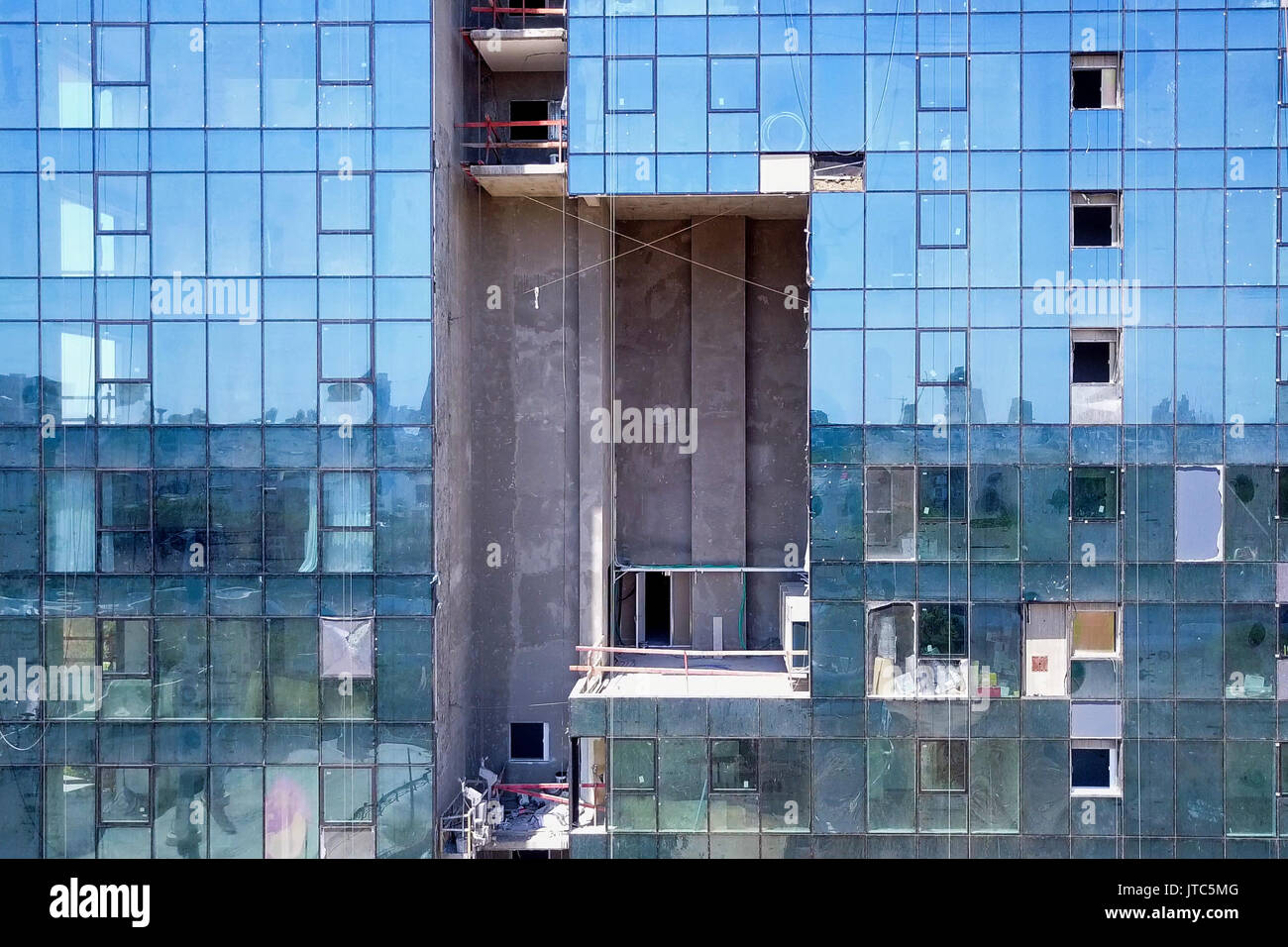 New Skyscraper building in final construction stage Stock Photo - Alamy