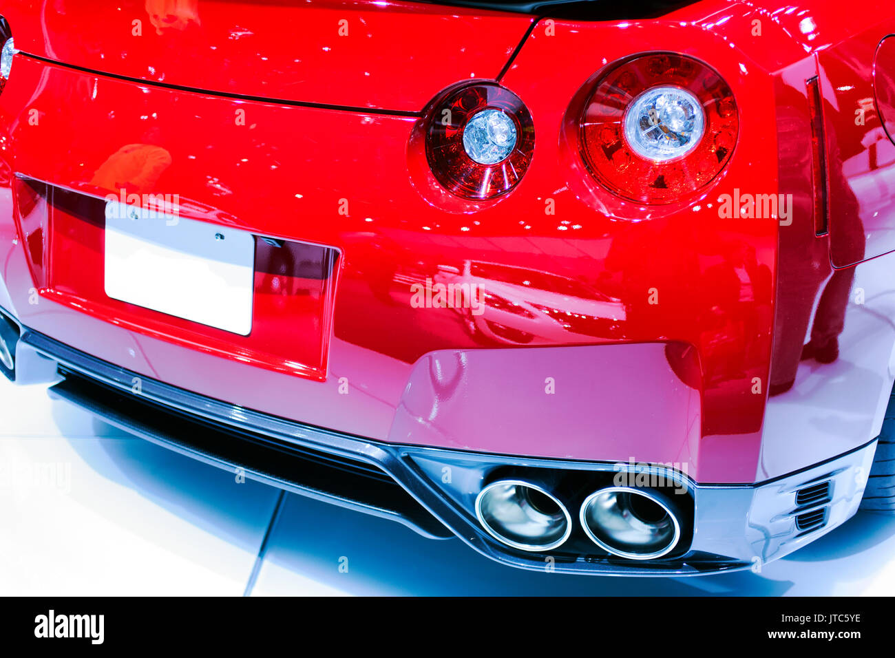 Back side of a red luxury sports car Stock Photo - Alamy
