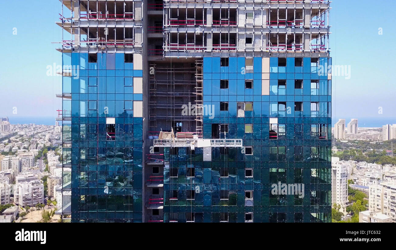 New Skyscraper building in final construction stage Stock Photo - Alamy