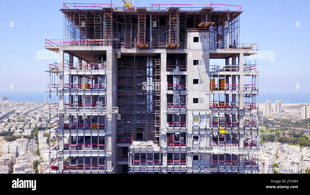 Aerial view of construction site and skyscrapers in background hi-res ...