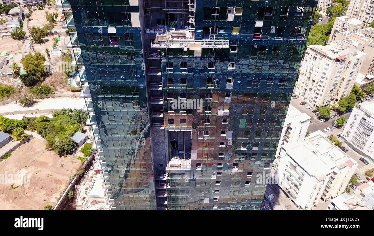 New Skyscraper building in final construction stage Stock Photo - Alamy